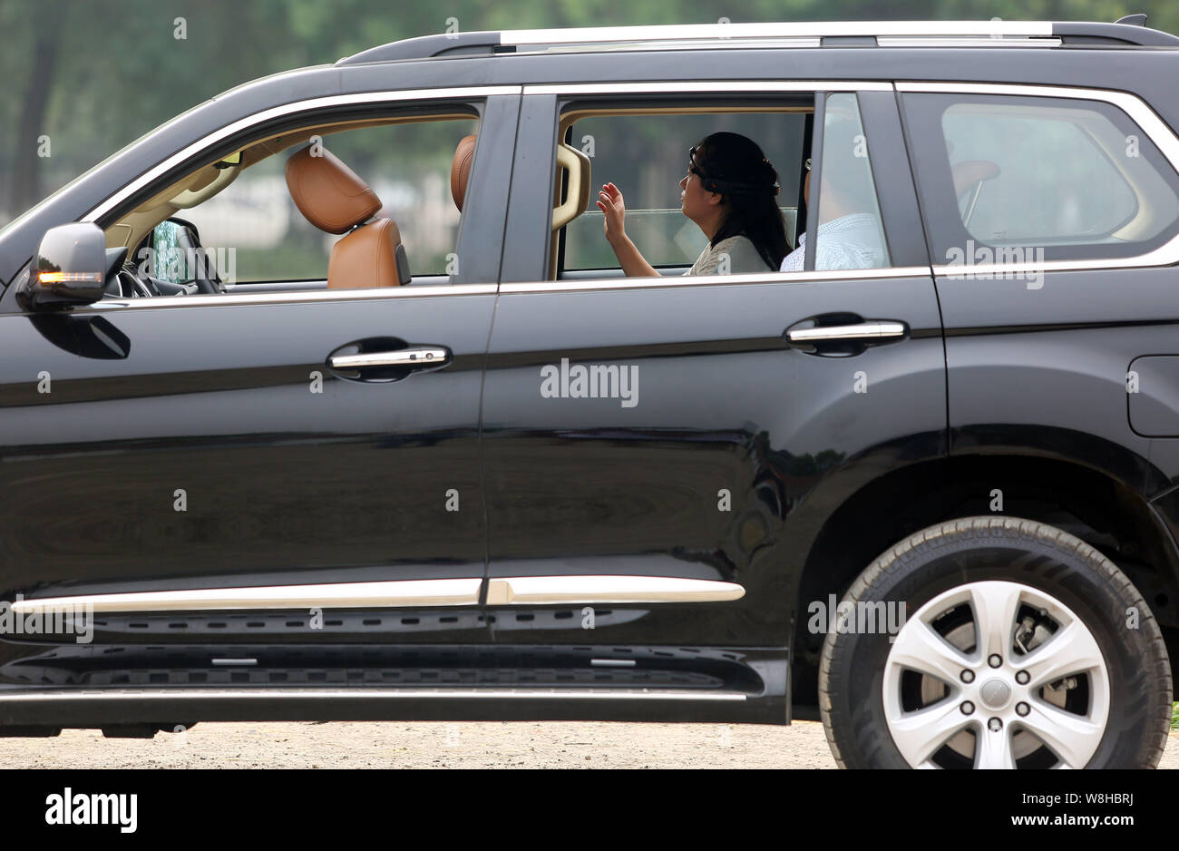A team member, wearing a headset with 16 sensors that sends impulses ...