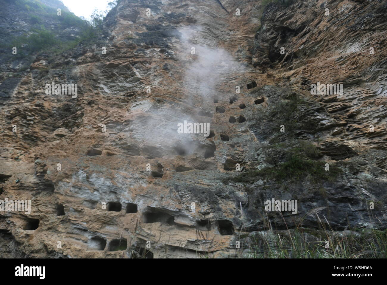 View of ancient Chinese 'hanging' coffins on the side of a 100 metre ...