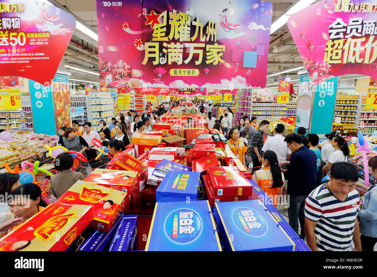 Chinese customers are shopping at a supermarket in Lianyungang city ...
