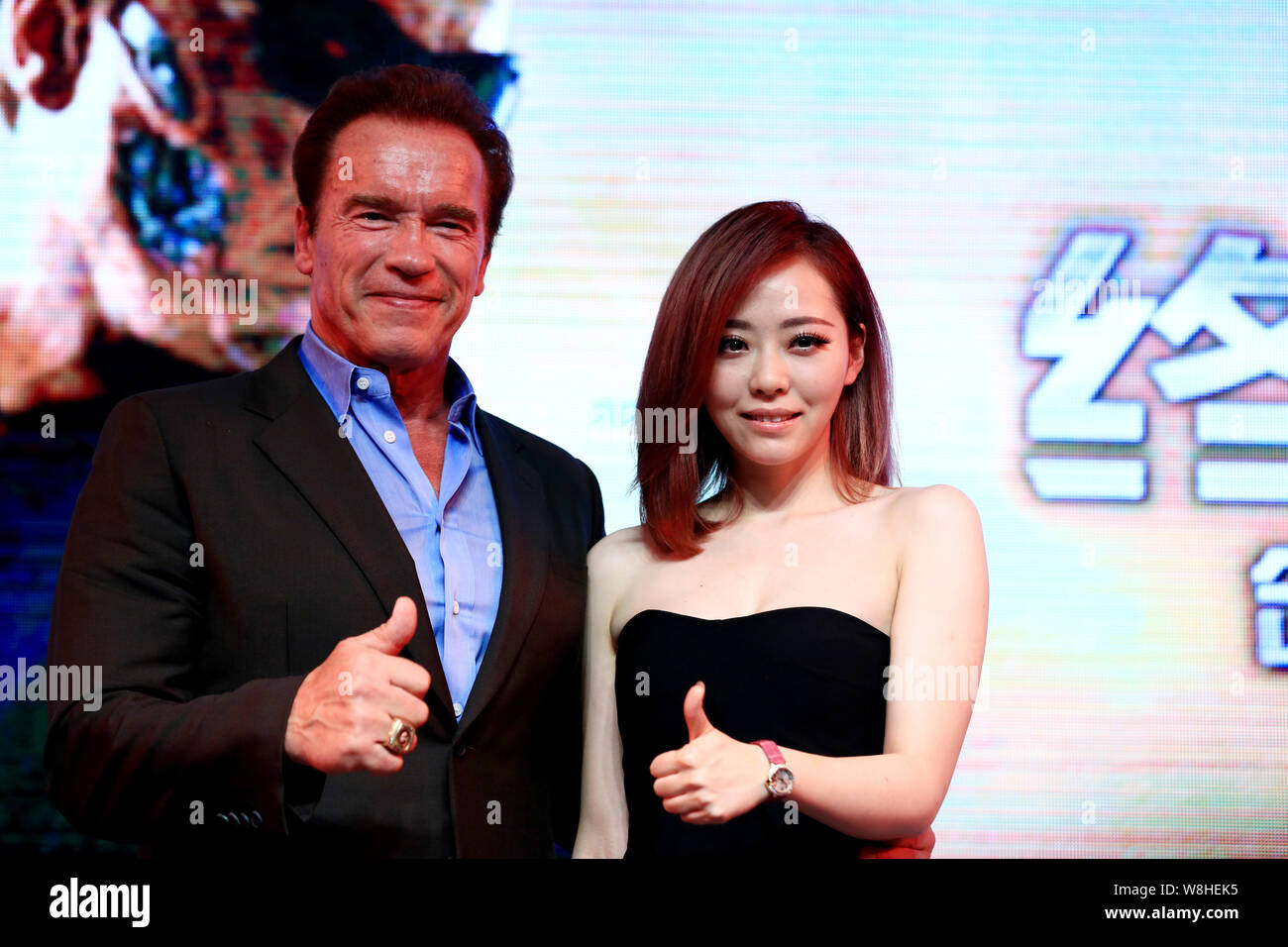 American actor Arnold Schwarzenegger, left, and Chinese signer Zhang ...