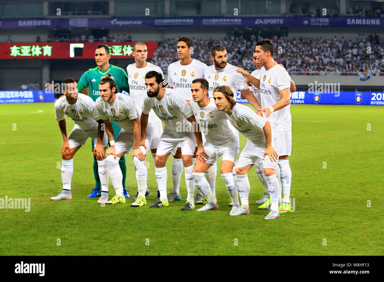 Players of the starting line-up of Real Madrid pose for photos before a ...
