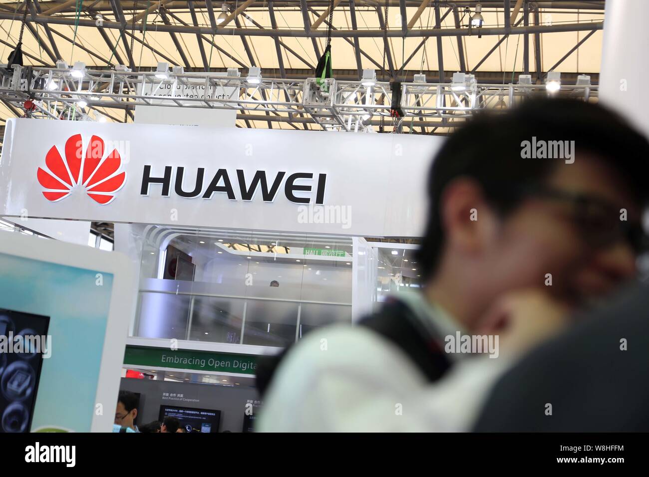 --FILE--People visit the stand of Huawei during an exhibition in ...