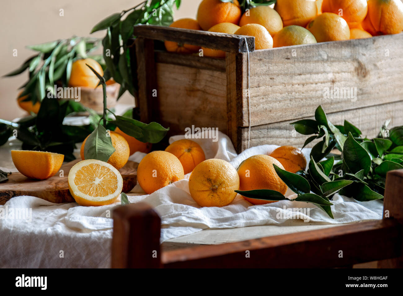 Table with box of fresh orange with orange tree branch and fresh orange ...