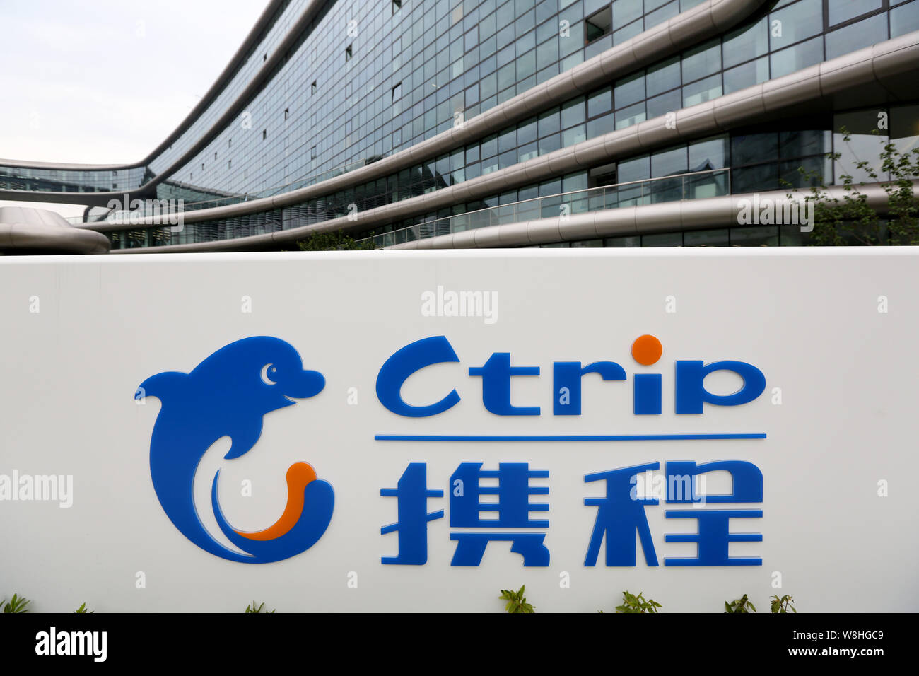--FILE--View of a signboard of Ctrip at the headquarters of Chinese ...