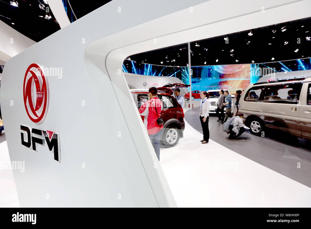 --FILE--Visitors look at cars of DFM (Dongfeng Motor) on display during ...