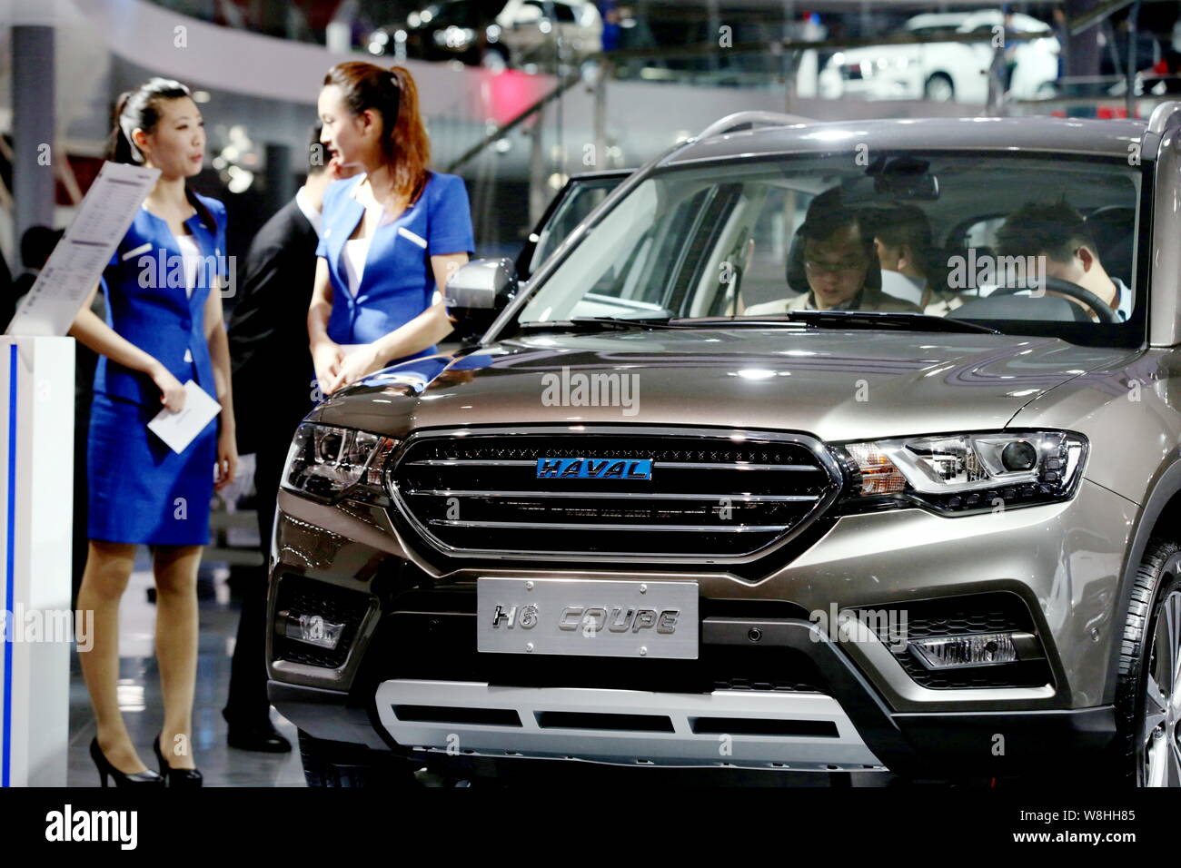 --FILE--Visitors try out a Haval H6 Coupe SUV of Great Wall Motor on ...