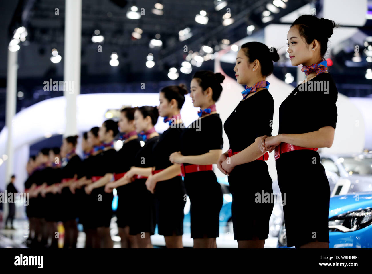 Hostesses pose in line at the stand of Buick of General Motors during ...