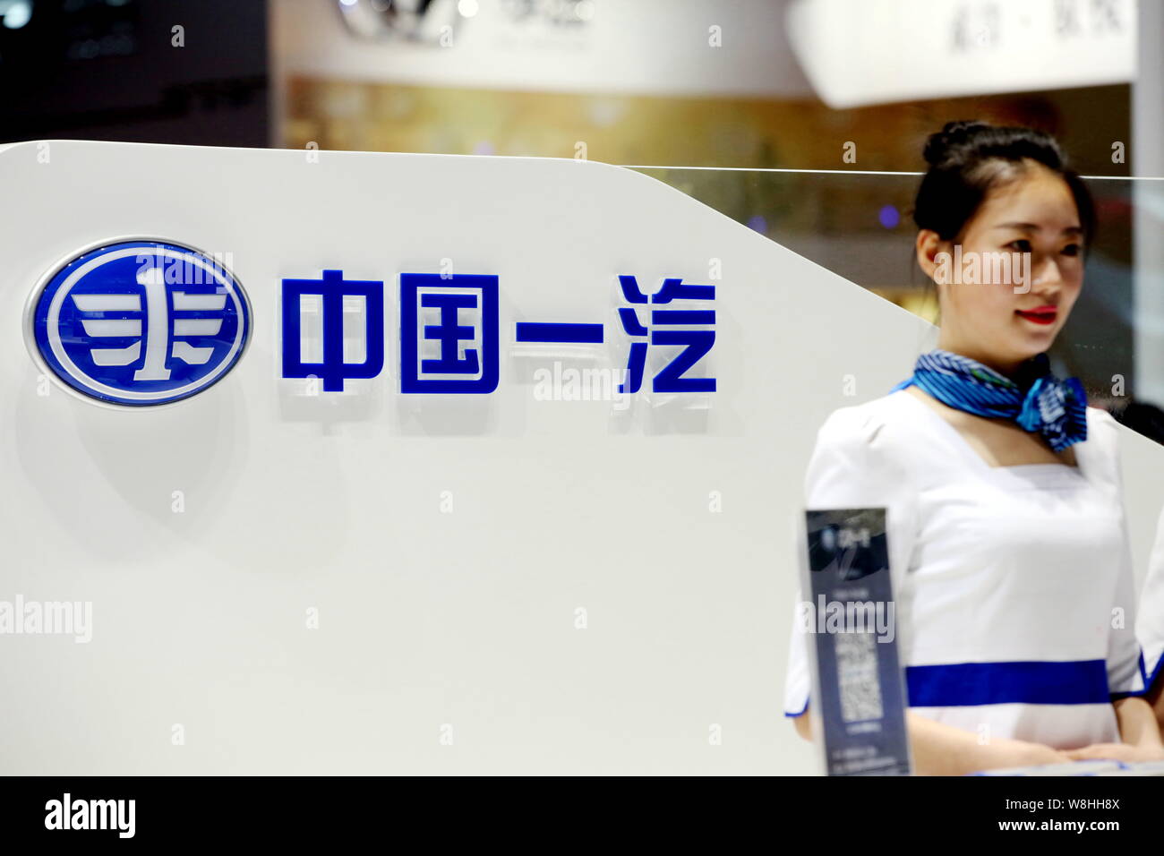 --FILE--A Chinese hostess poses at the stand of FAW during the 16th ...