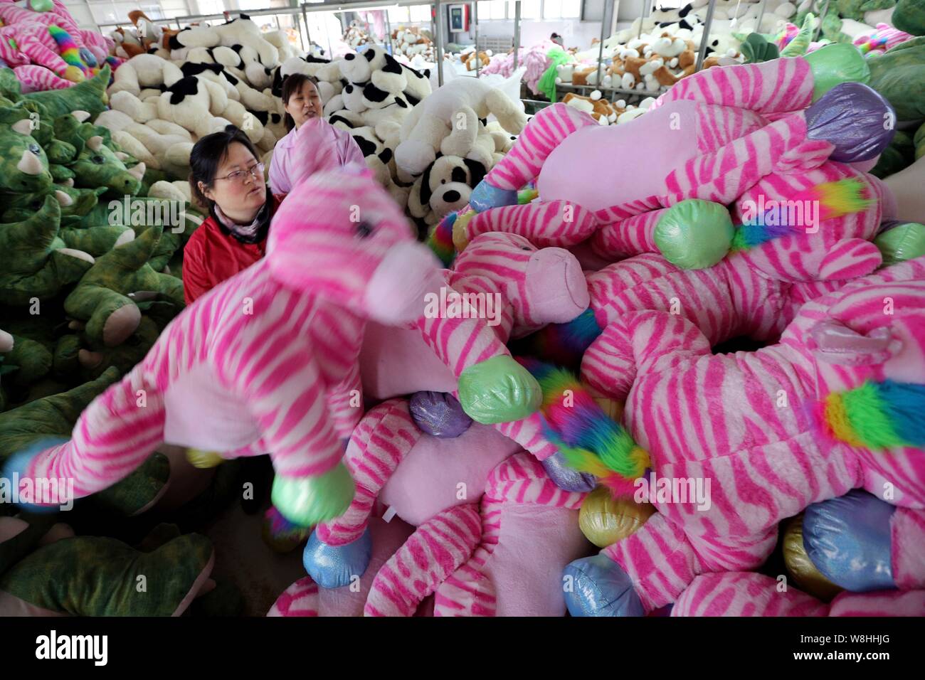 --FILE--Female Chinese workers sew stuffed toys at a toy factory in ...