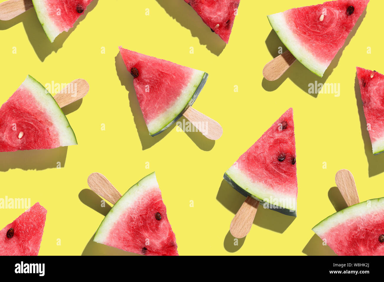 Watermelon pattern. Sliced watermelon on color background Stock Photo ...