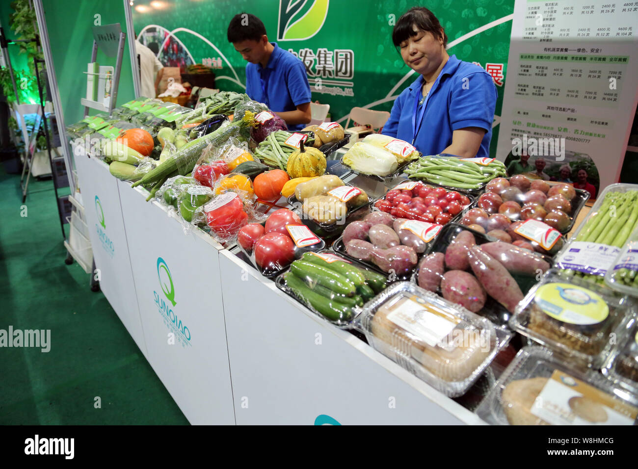 Organic vegetables are on display and for sale at a stand during the ...