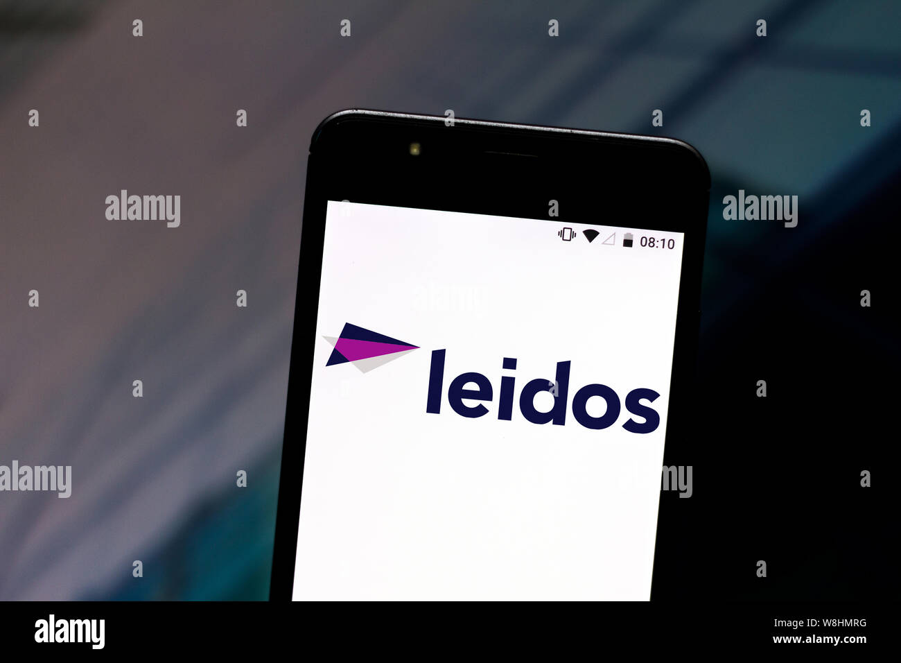 In this photo illustration the Leidos logo is seen displayed on a ...
