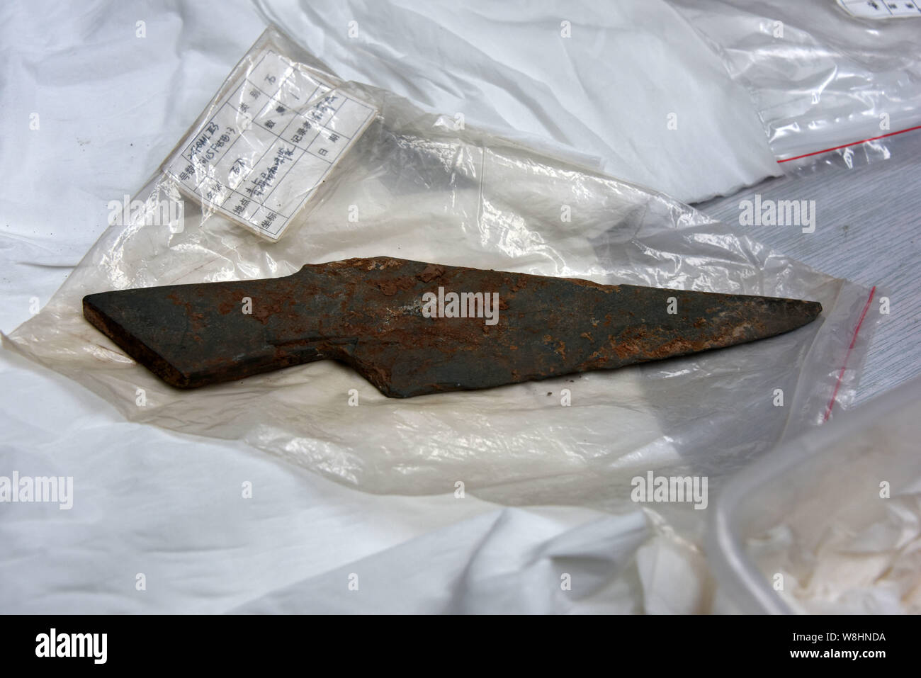 View of a stone knife unearthed at the early Bronze Age archaeological ...