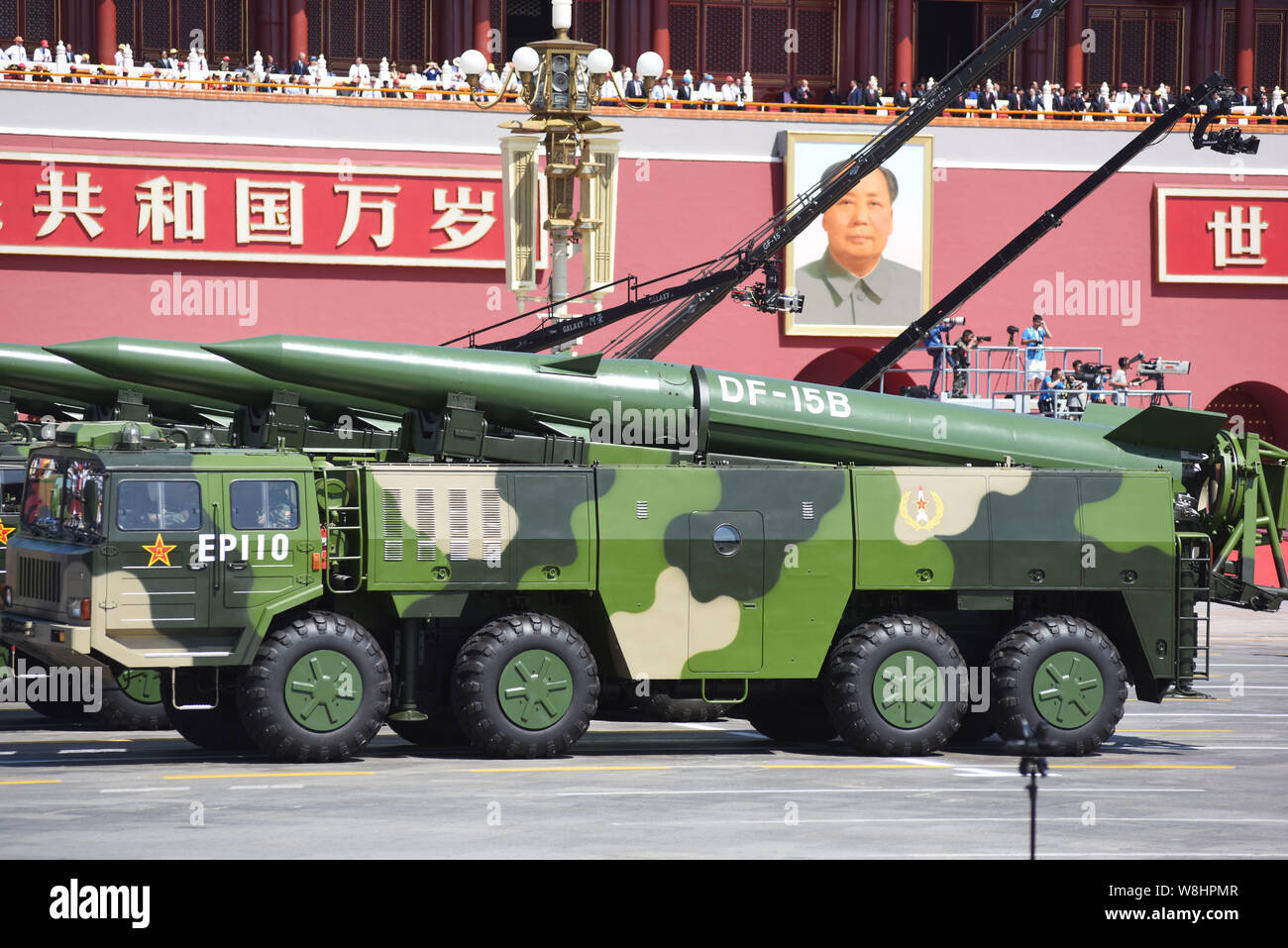 Military vehicles carrying DF-15B short-range ballistic missiles march ...