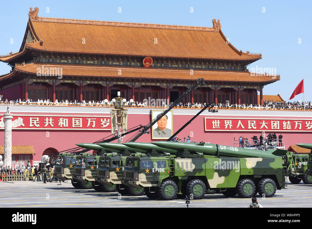 Military vehicles carrying DF-15B short-range ballistic missiles march ...