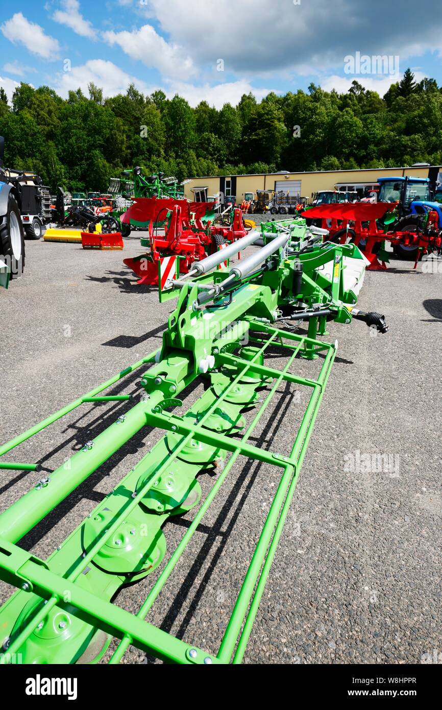 Farming mowers, tractors and plows exhibited in a farming yard Stock ...