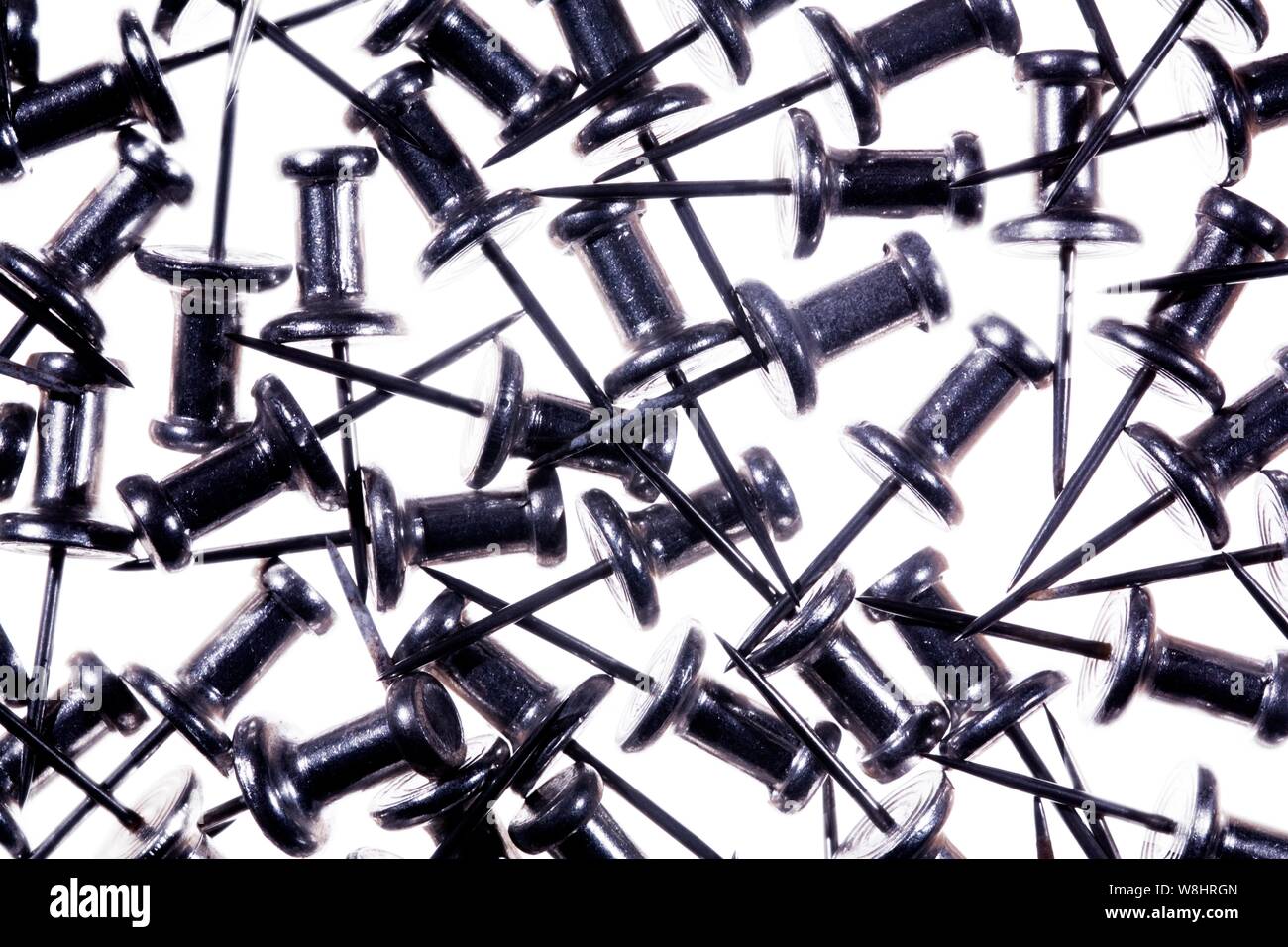 Push pins against white background Stock Photo - Alamy