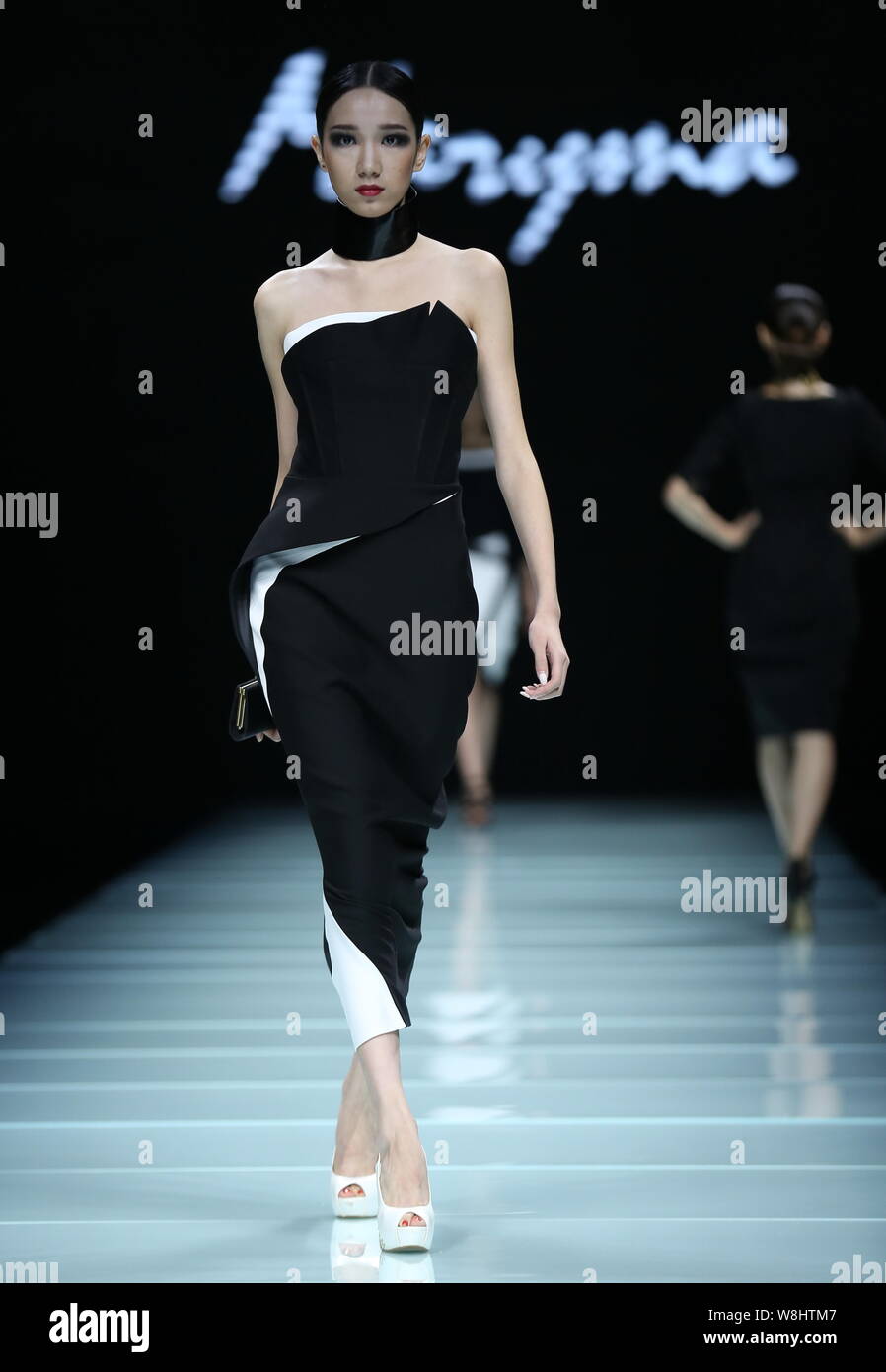 A model displays a new creation by Chinese fashion designer Mary Ma in ...
