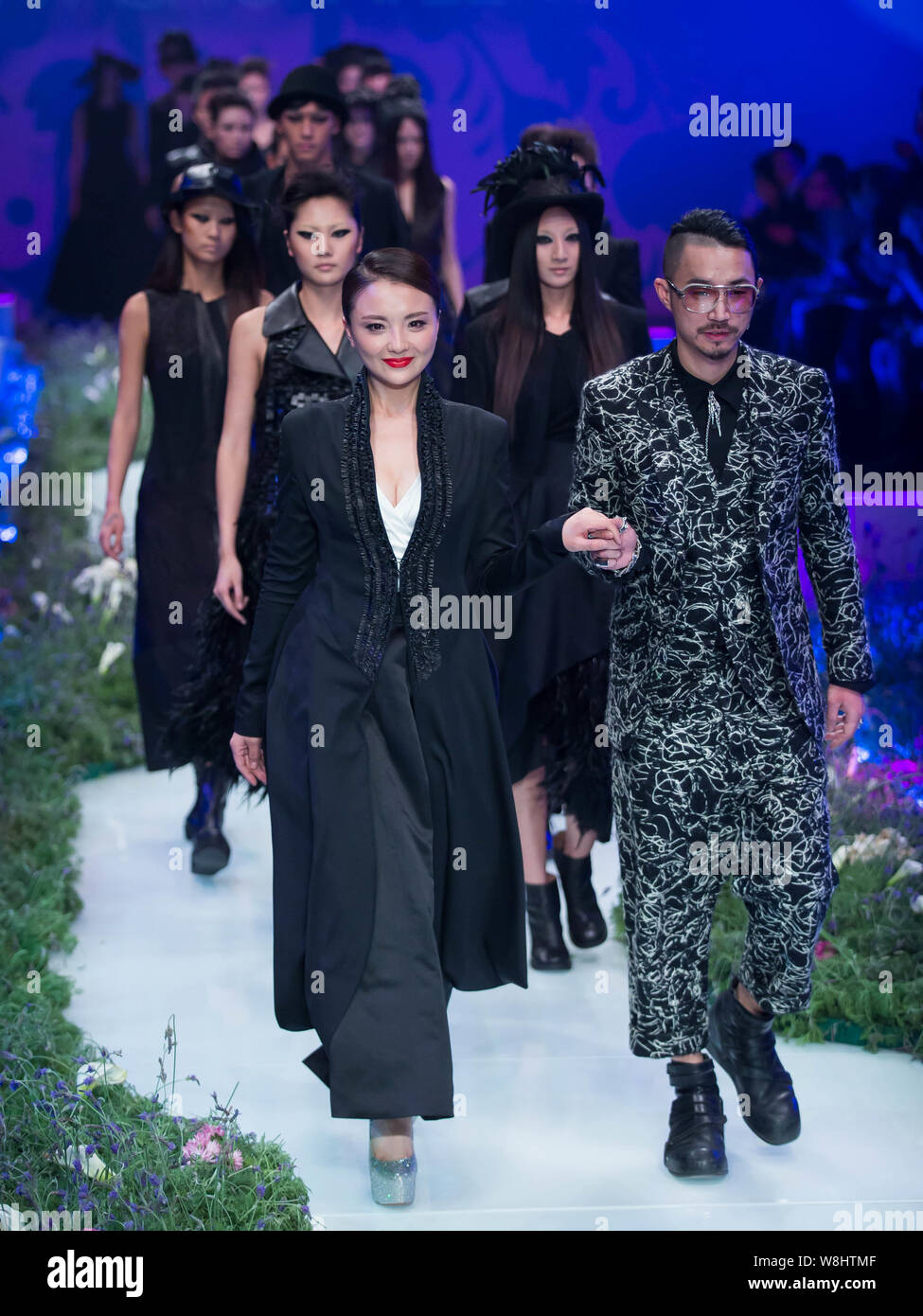 Models display new creations designed by Liu Shixi at the "The ...