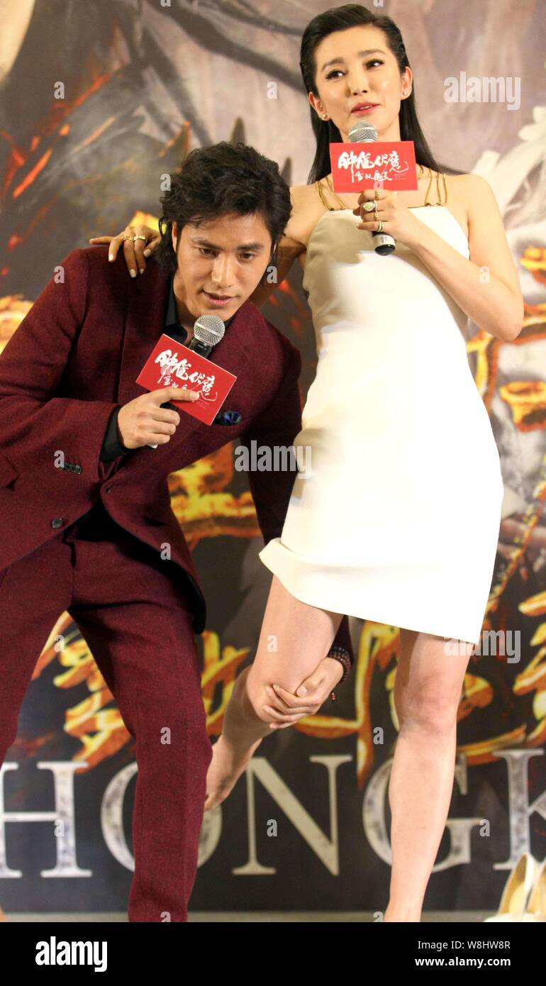 Chinese actor Chen Kun, left, tries to hold up actress Li Bingbing ...