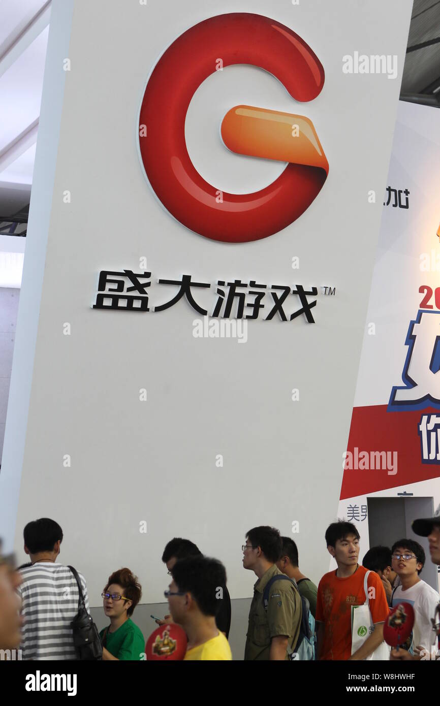 --FILE--Visitors walk past the stand of Shanda Games during the 10th ...
