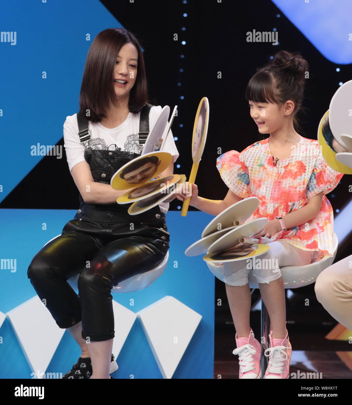 Chinese actress Vicki Zhao Wei, left, interacts with child star Ji ...