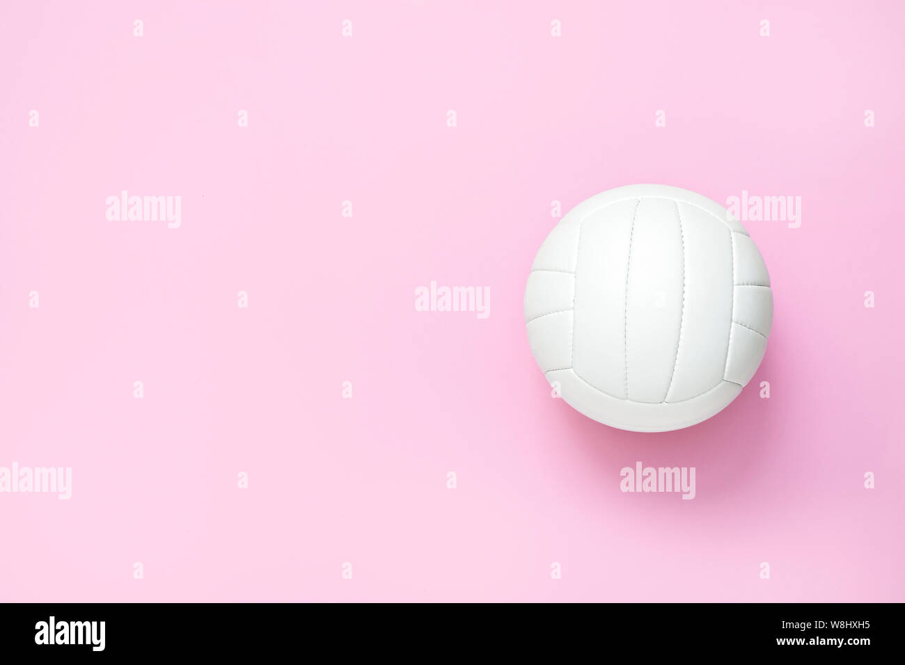 White volleyball leather ball on pink background. Top view Stock Photo ...