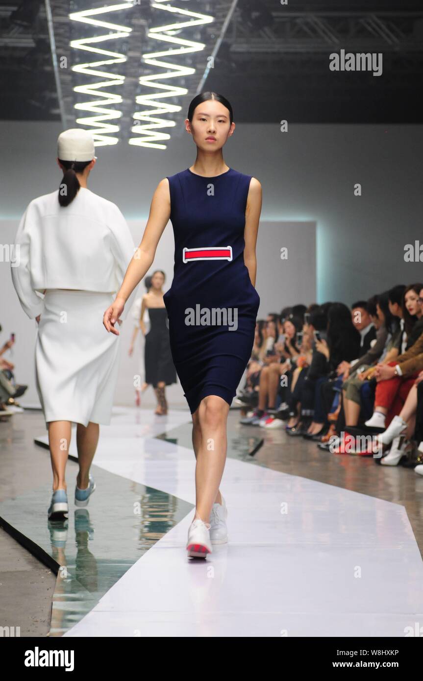 A model displays a new creation at the fashion show for the Spring ...