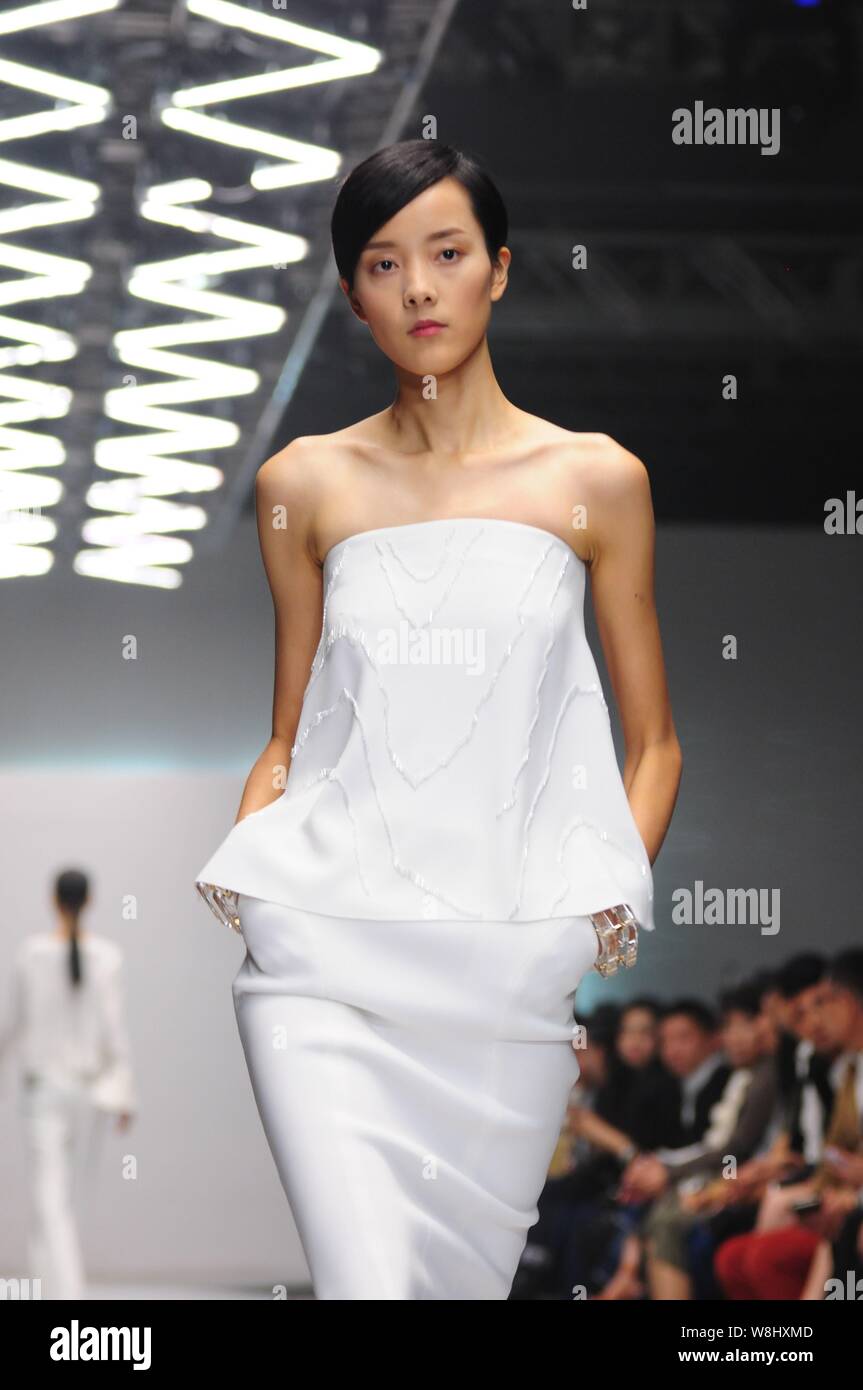 Chinese model Pei Bei displays a new creation at the fashion show for ...