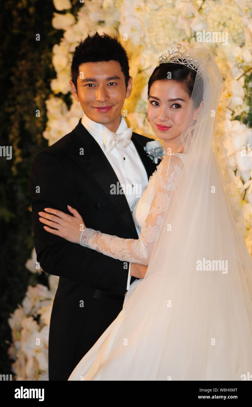 Chinese actor Huang Xiaoming, left, and his actress wife Angelababy ...