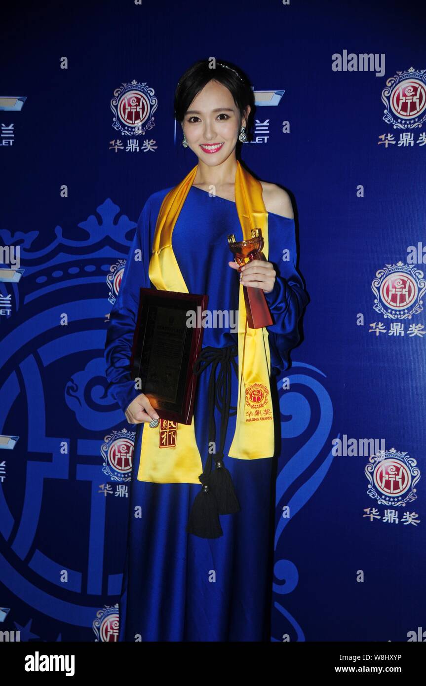 Chinese actress Tang Yan poses with her trophy during the 17th Huading ...