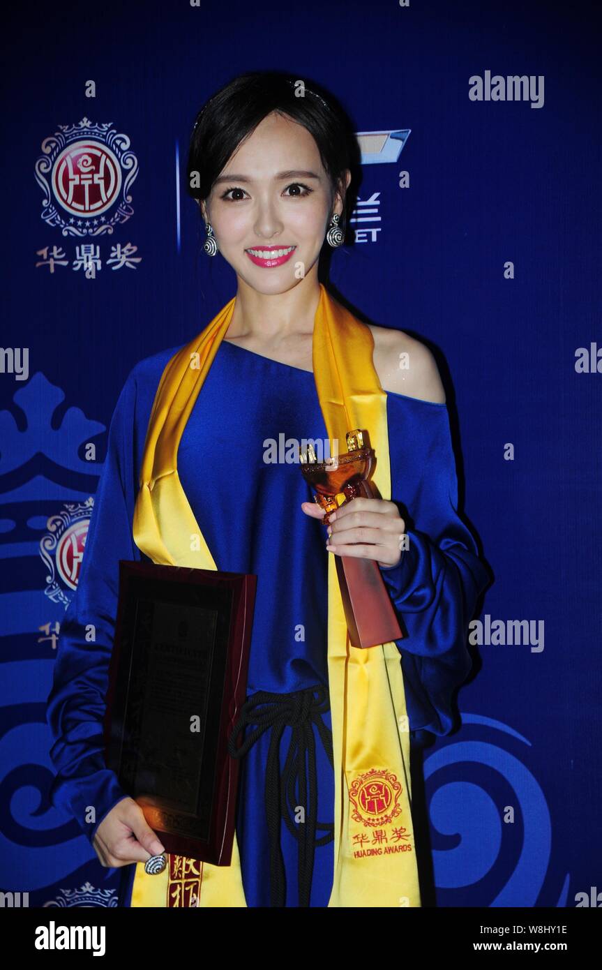 Chinese actress Tang Yan poses with her trophy during the 17th Huading ...