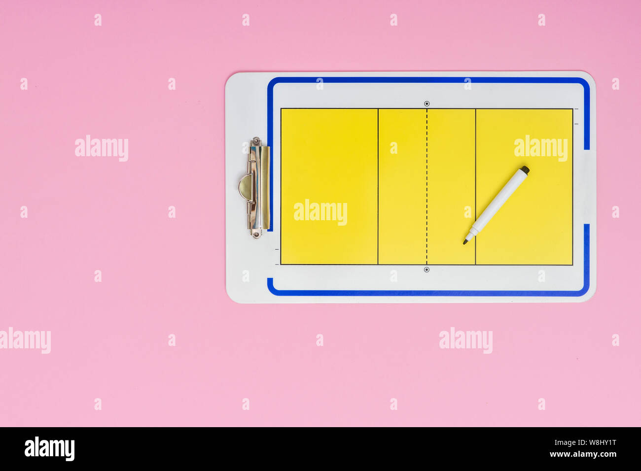 Volleyball tactical board with marker on pink background. Top view ...