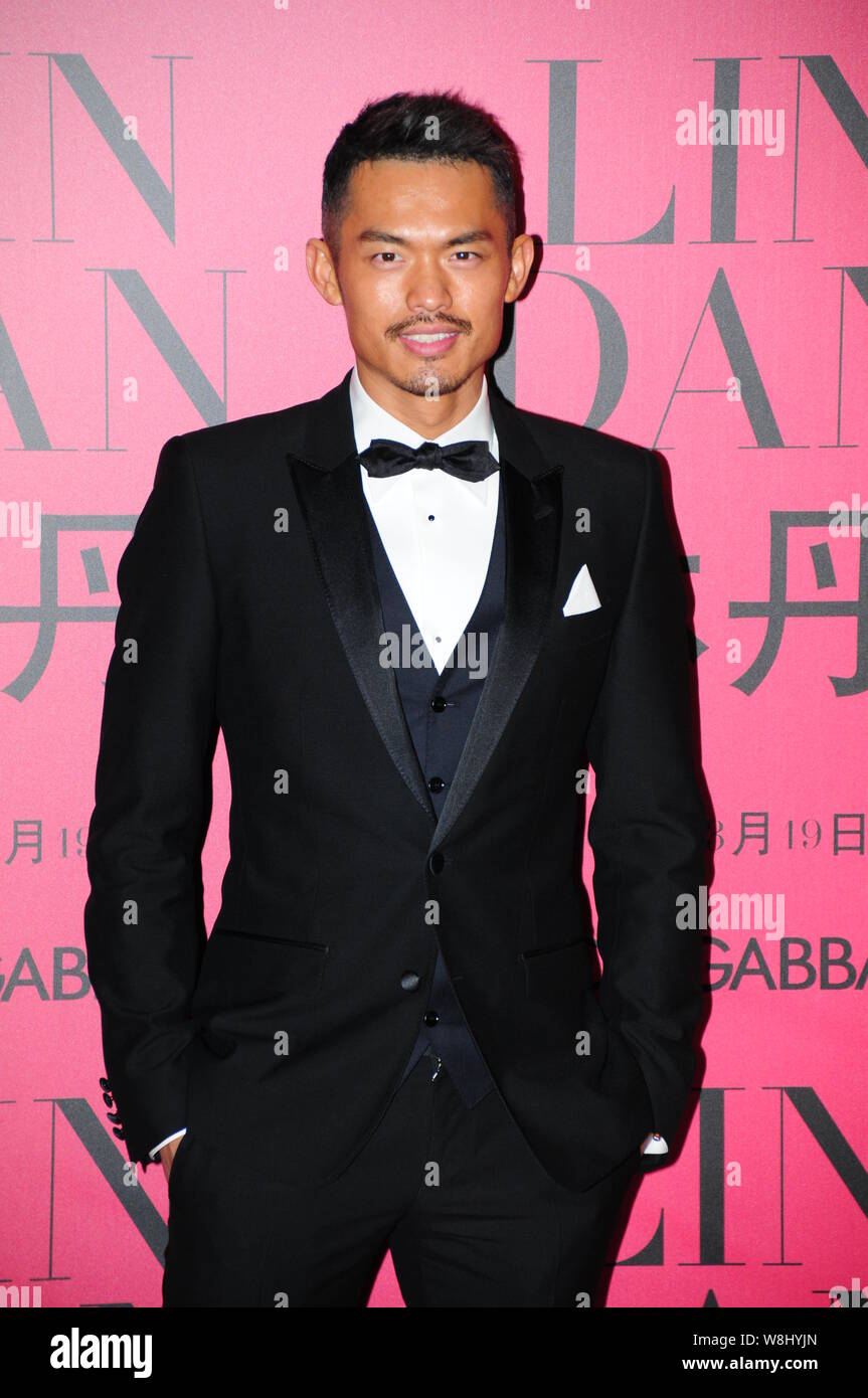 Chinese badminton star Lin Dan poses during the Dolce & Gabbana ...