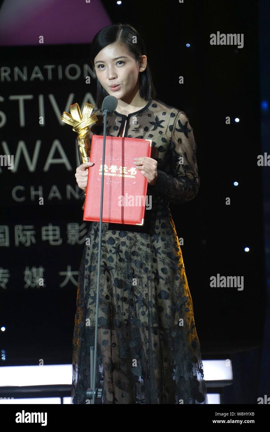 Chinese actress Yang Zishan speaks as she holds the trophy for the Best ...