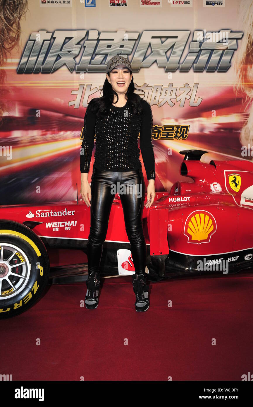 Canadian actress Christy Chung poses with a Ferrari Formula One race ...