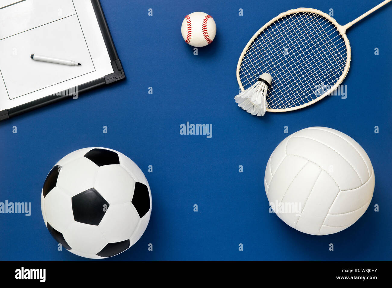 Assorted sports equipment on a blue background with copy space Stock ...