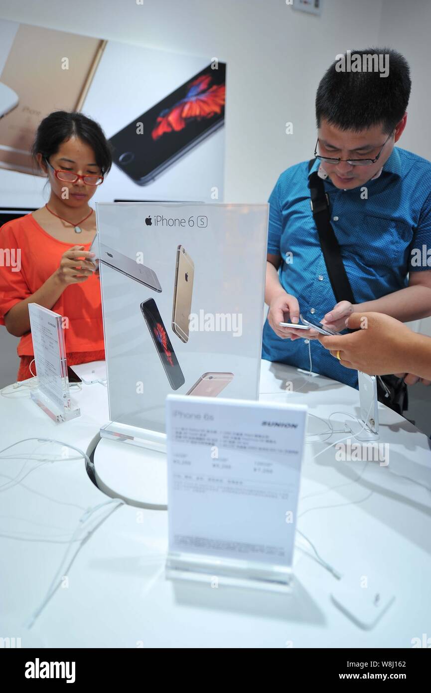 --FILE--Customers try out iPhone 6s smartphones at an Apple store in ...