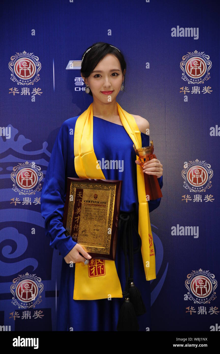 Chinese actress Tang Yan poses with her trophy during the 17th Huading ...