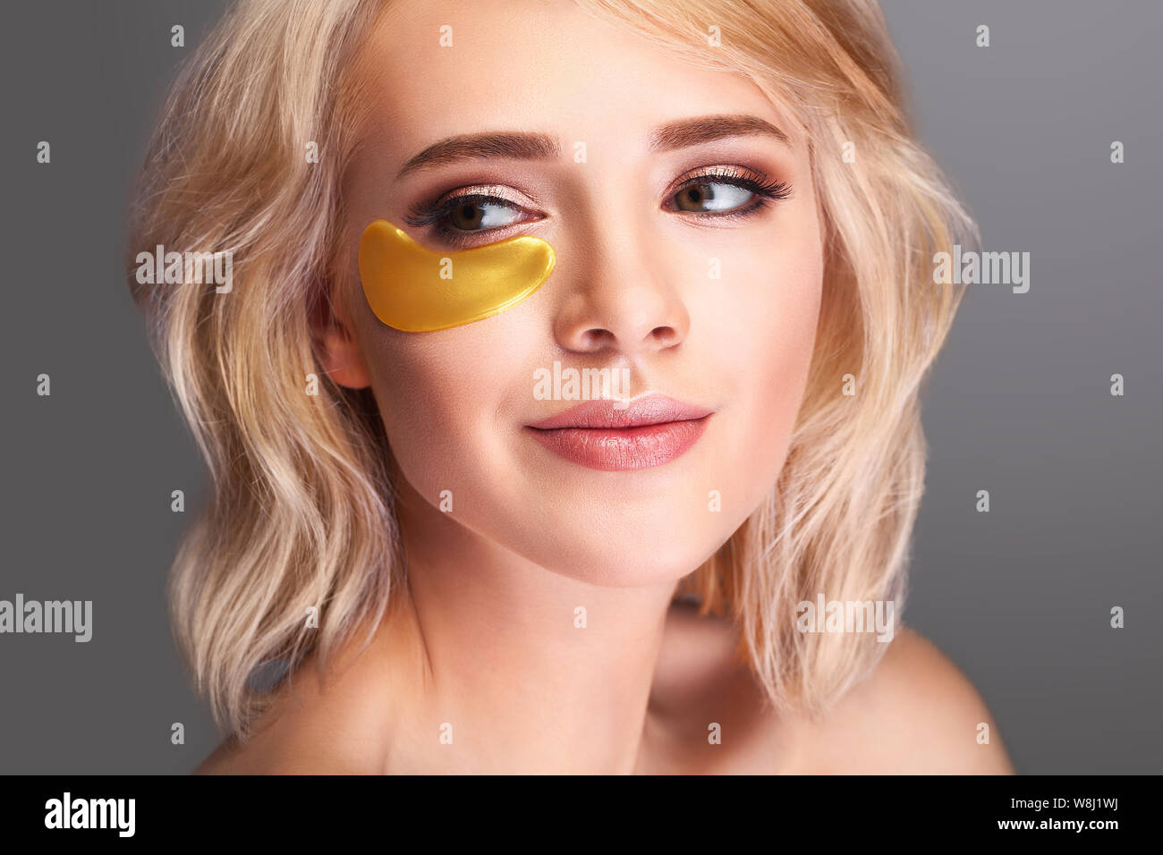 Patch Under Eyes. Beautiful Woman Face With Gold Hydrogel Patches ...