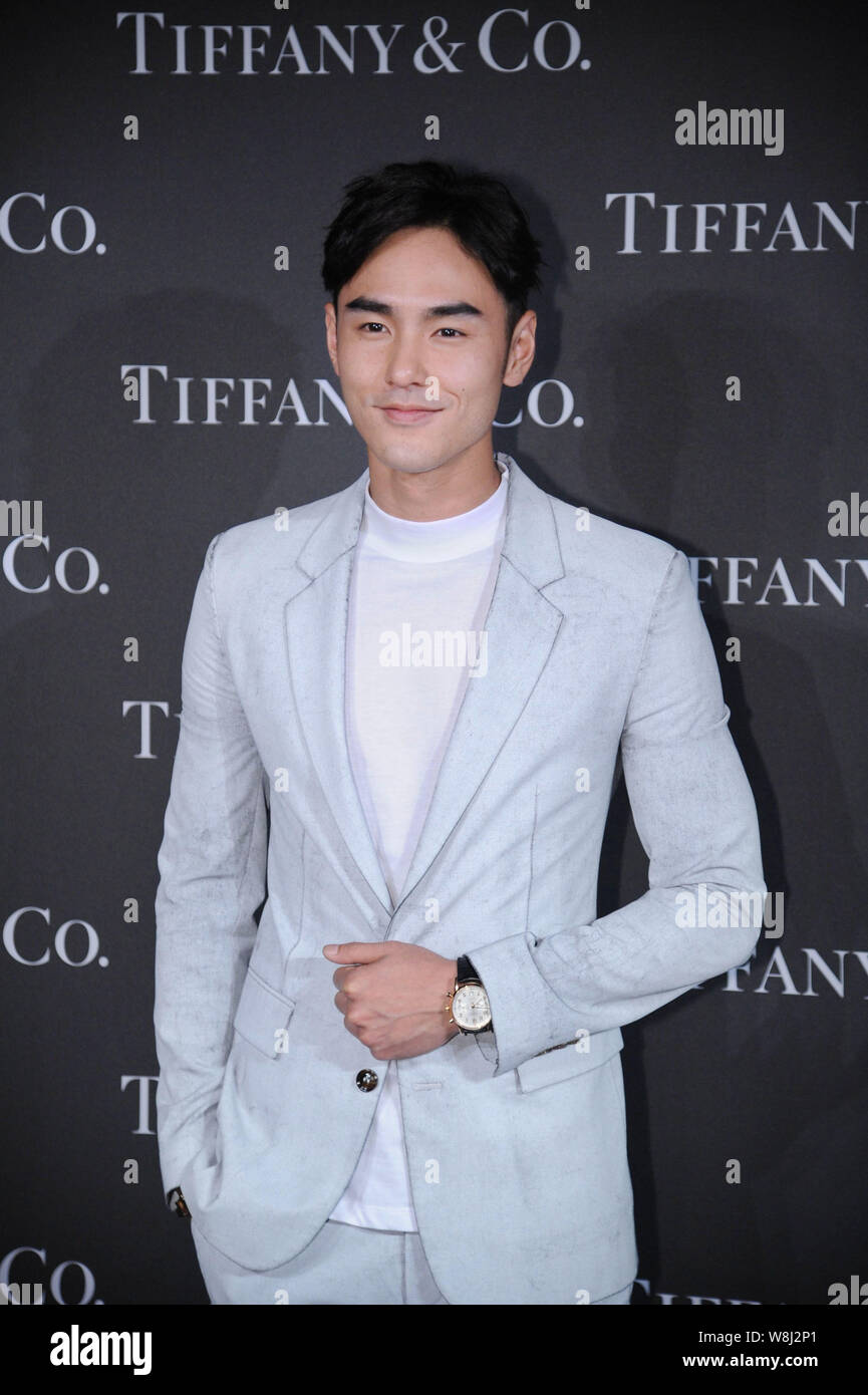 Taiwanese actor Ethan Juan poses as he arrives for a new products ...