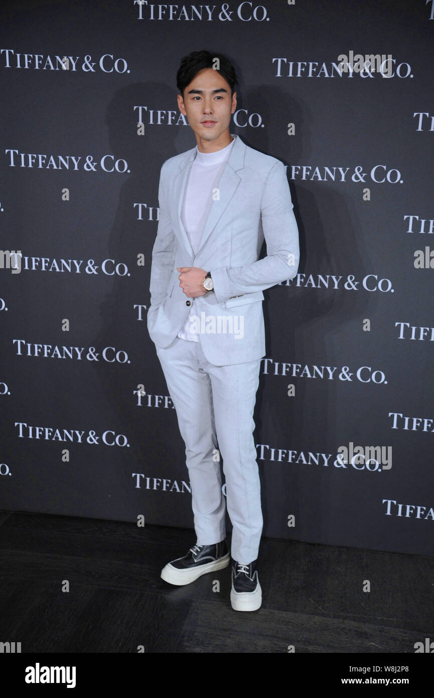 Taiwanese actor Ethan Juan poses as he arrives for a new products ...