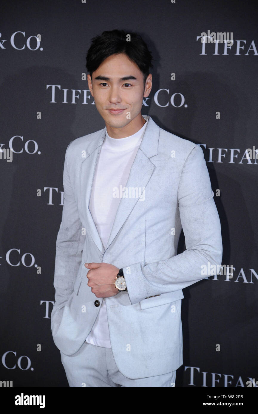 Taiwanese actor Ethan Juan poses as he arrives for a new products ...