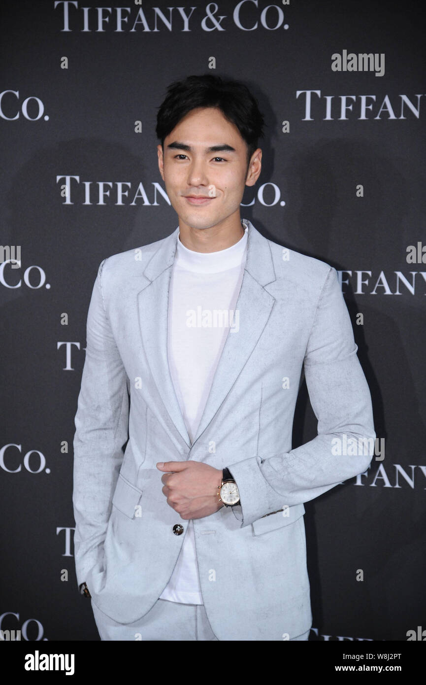 Taiwanese actor Ethan Juan poses as he arrives for a new products ...