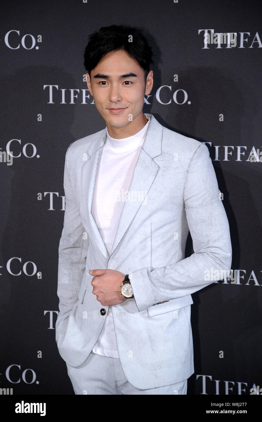 Taiwanese actor Ethan Juan poses as he arrives for a new products ...