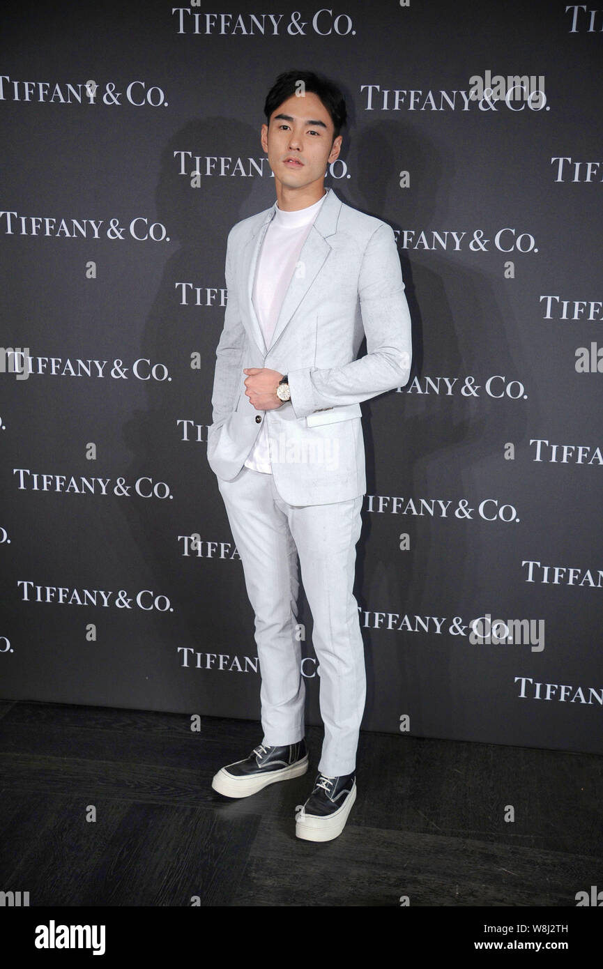Taiwanese actor Ethan Juan poses as he arrives for a new products ...