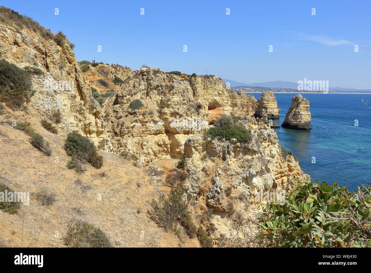A view of the Atlantic ocean and the limestone pillars jutting out from ...