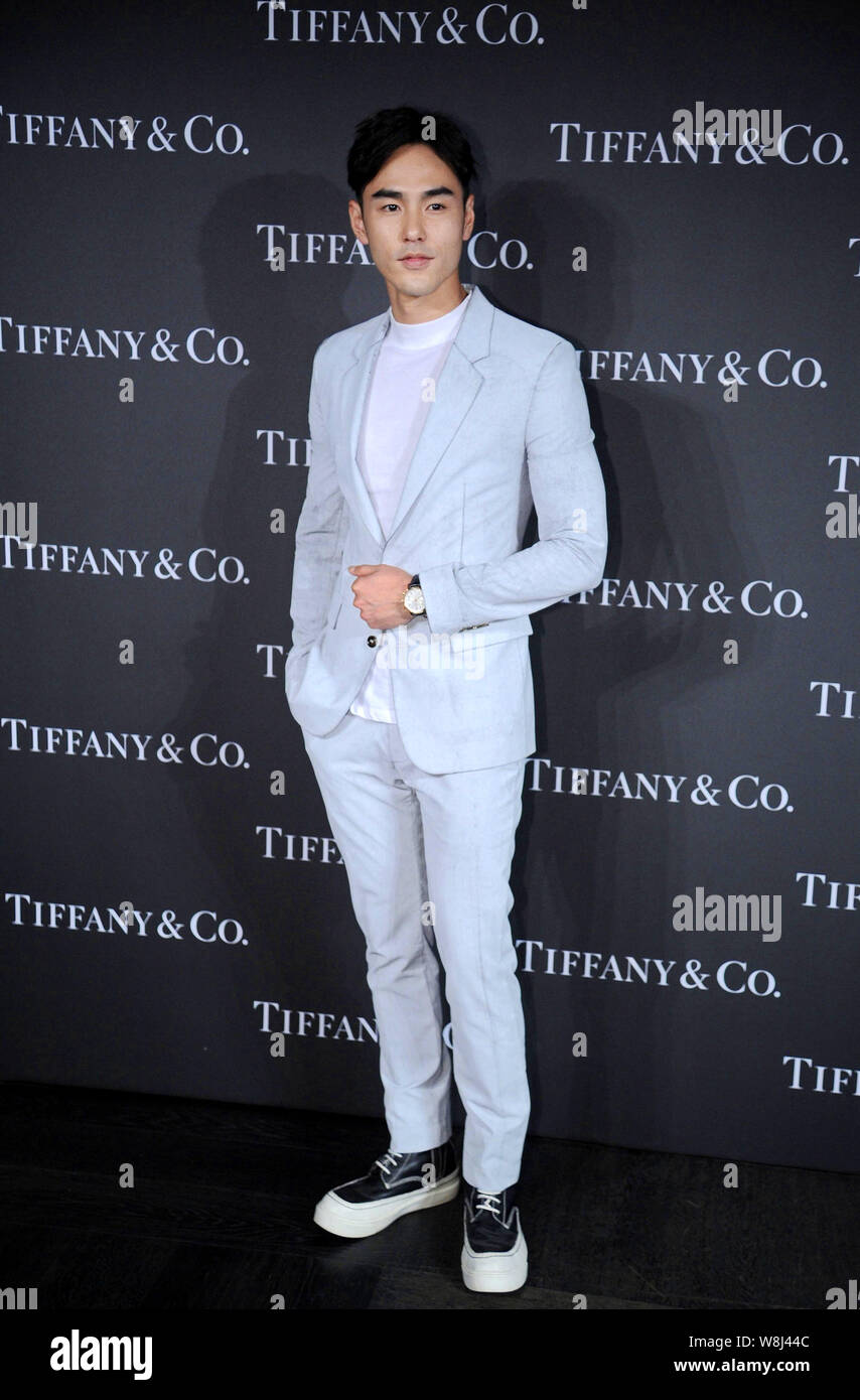 Taiwanese actor Ethan Juan poses as he arrives for a new products ...