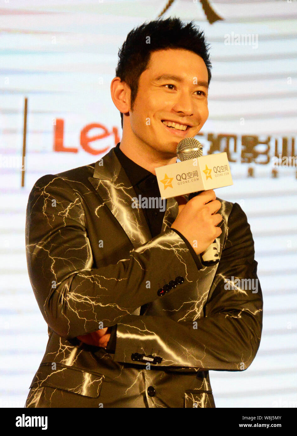 Chinese actor Huang Xiaoming smiles during a press conference for his ...