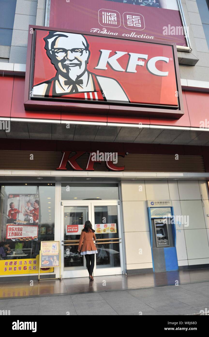--FILE--A customer walks towards a KFC fastfood restaurant of Yum ...